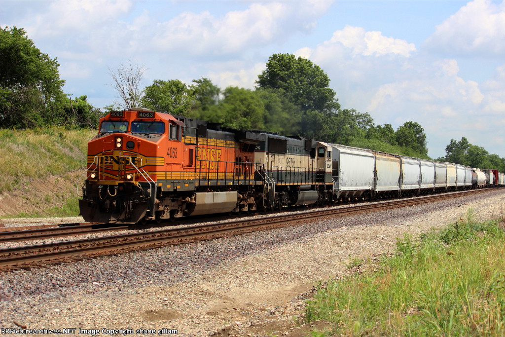 BNSF 4063 heads wb on a mixed freight train.
